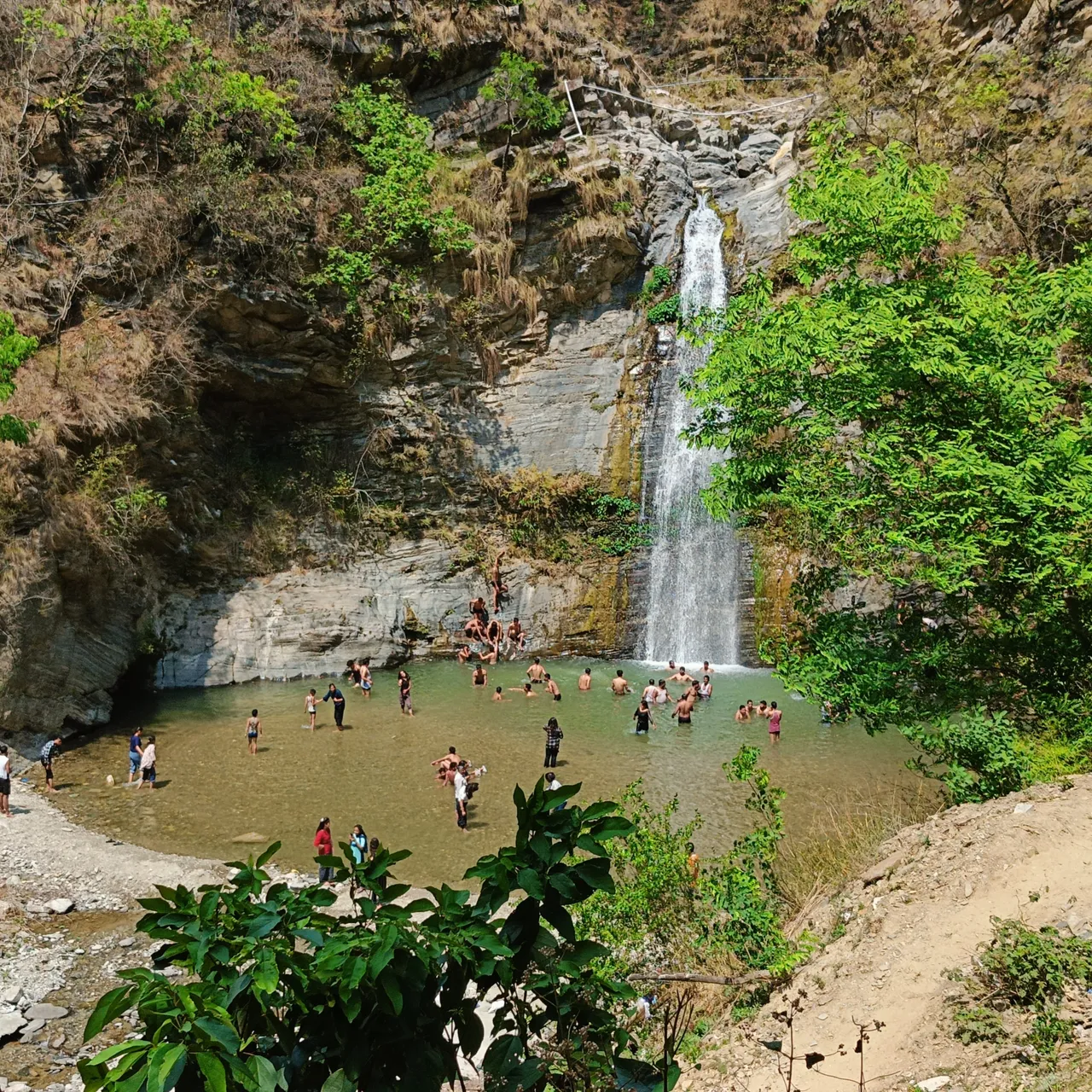 "Azure Tranquility: Experiencing the Beauty of Dhokane Waterfall"