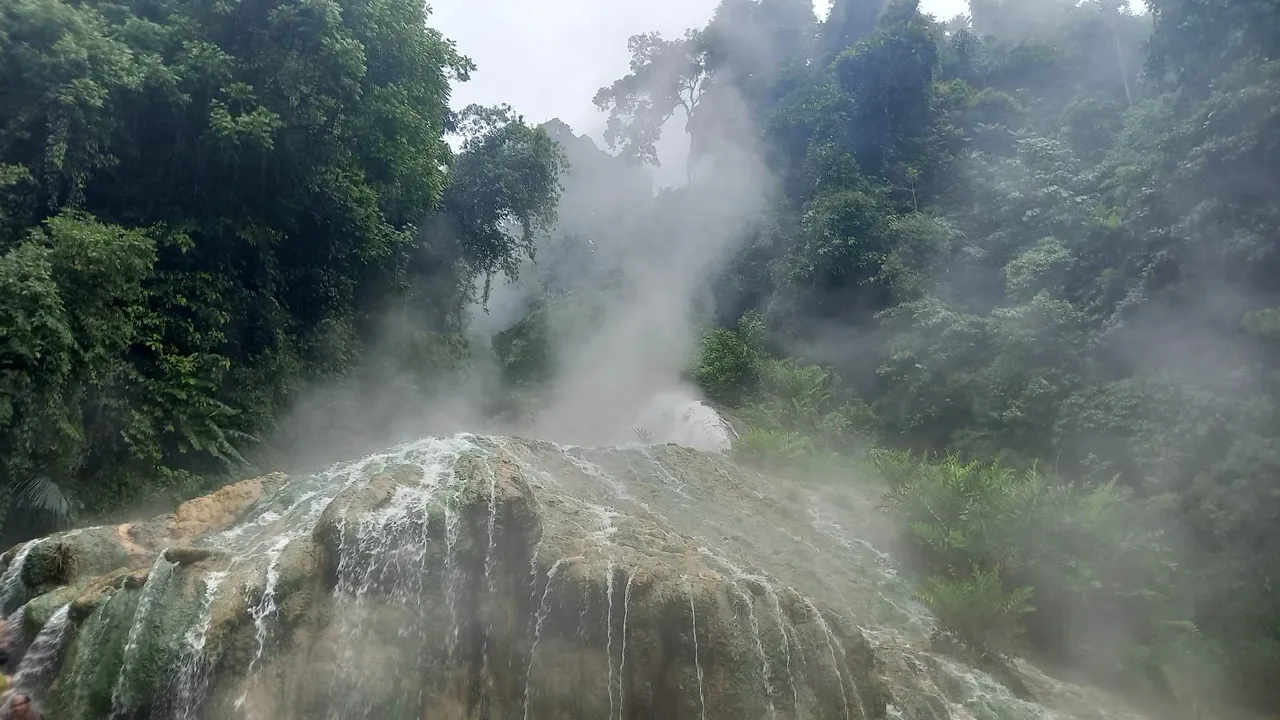Steaming under the rain at Bilawa Mainit Hot Waterfall, Davao de Or...