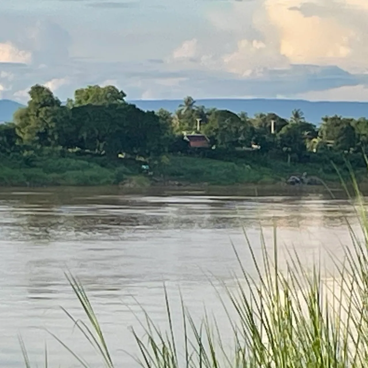 Cycling along the river to enjoy peaceful moment.