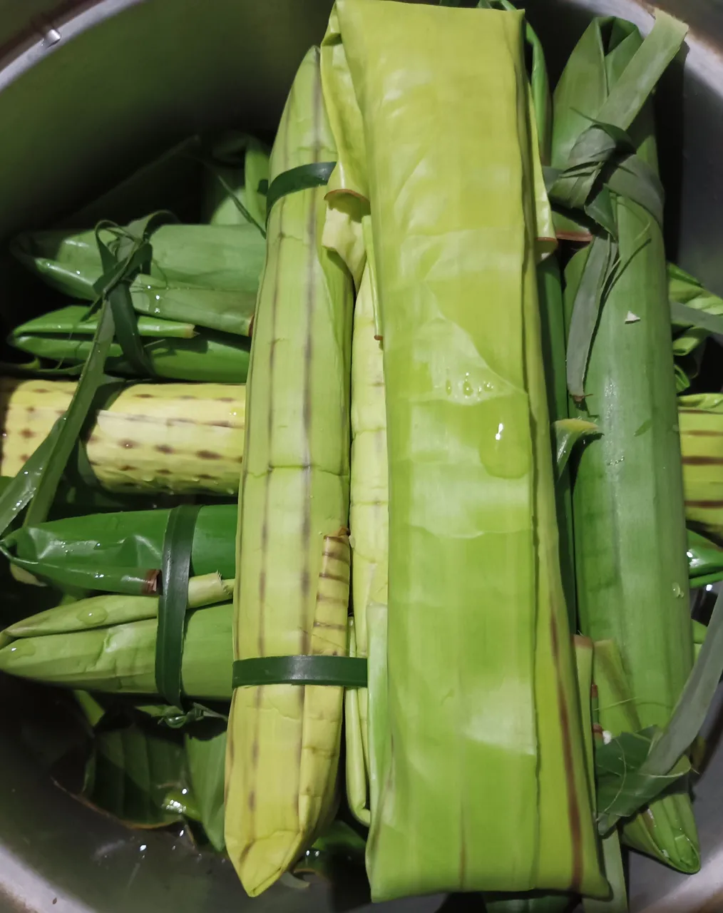 Cassava rolls wrapped with banana leaves